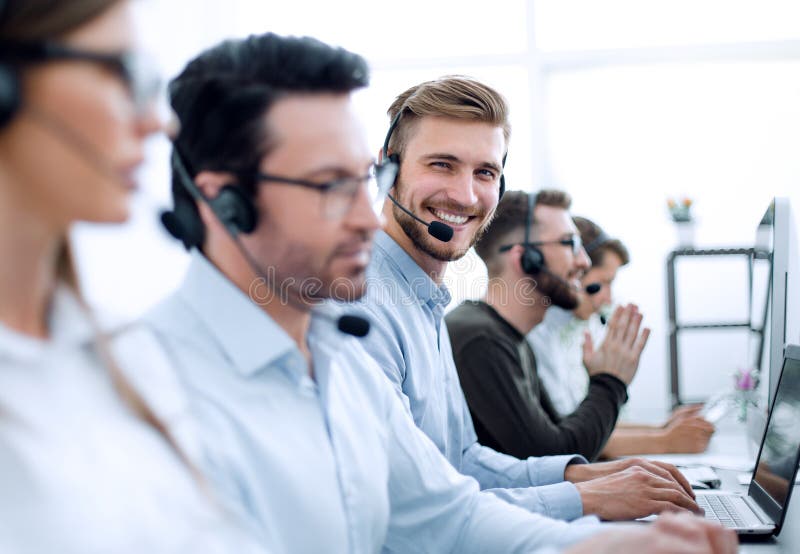 Handsome Male Customer Support Phone Operator with Headset Working in ...