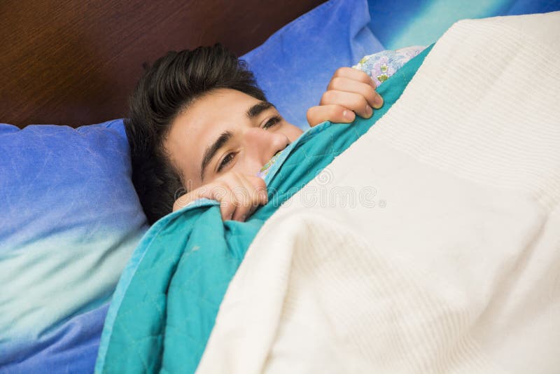 Handsome Male Model Lying Alone on His Bed Stock Image - Image of ...