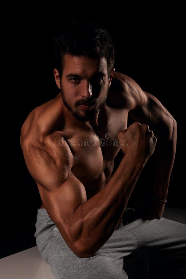 Handsome Male Model Posing and Showing His Arm Muscles Stock Image ...