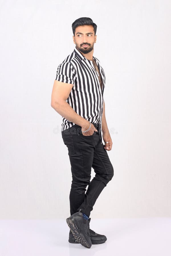 Young Handsome Indian Male Model Posing Against Gray Background Stock ...