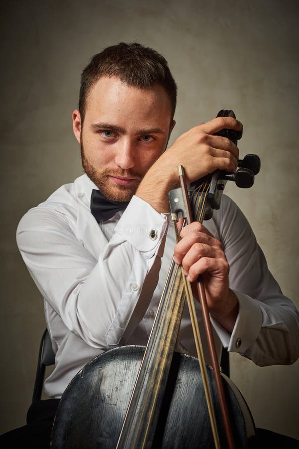 Handsome Male Playing on Antique Black Cello Stock Image - Image of ...