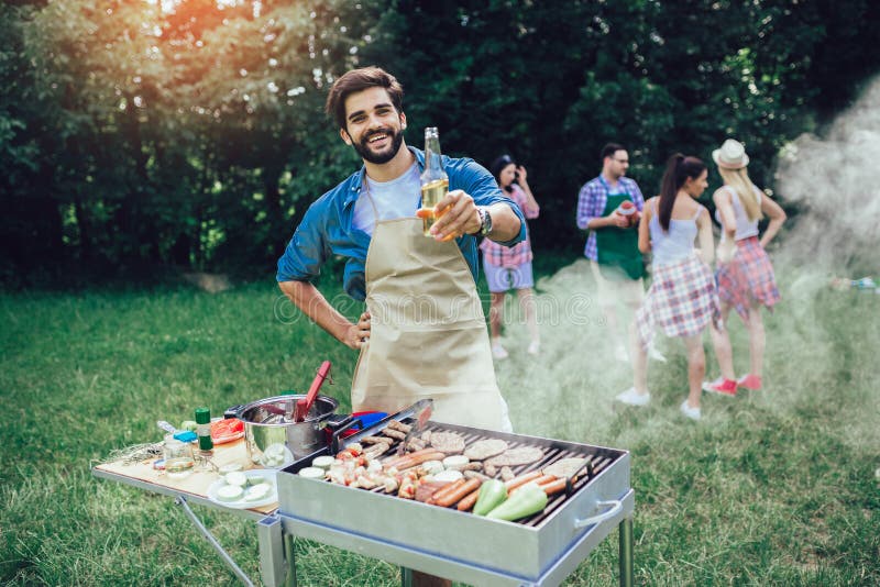 Male Preparing Barbecue Outdoors for Friends Stock Image - Image of ...