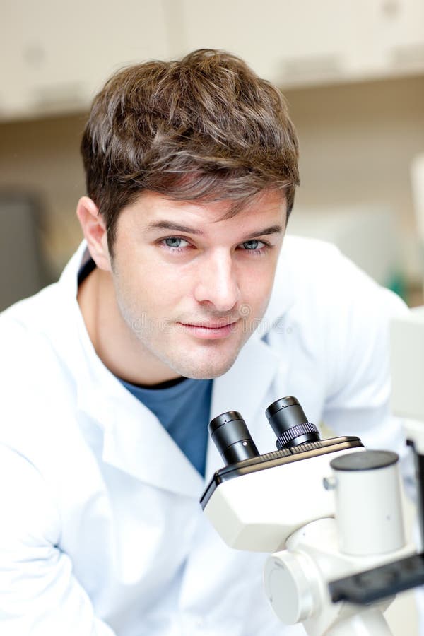 Handsome Male Scientist Using a Microscope Stock Photo - Image of ...