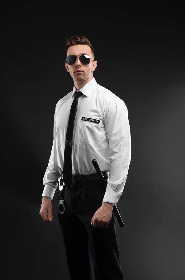 Handsome Male Security Guard In Uniform On Dark Background Stock Image ...