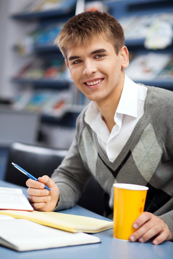 Handsome Male Student in a Library Stock Photo - Image of indoor ...