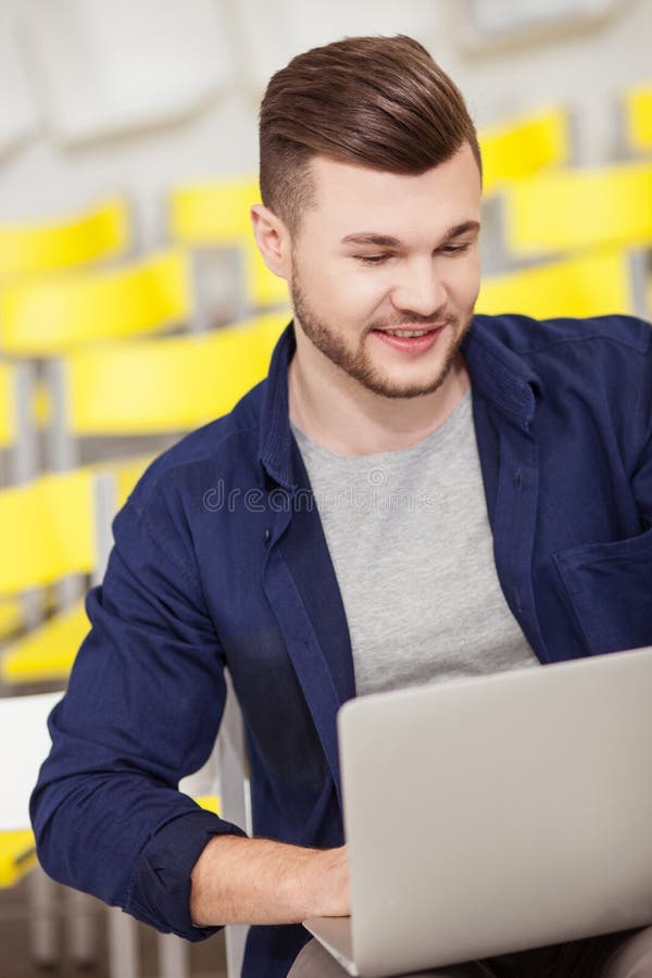 Young Man Looking Thoughtful Working Laptop Computer Holding Knees ... Young Man Looking Thoughtful Working Laptop Computer Holding Knees ...