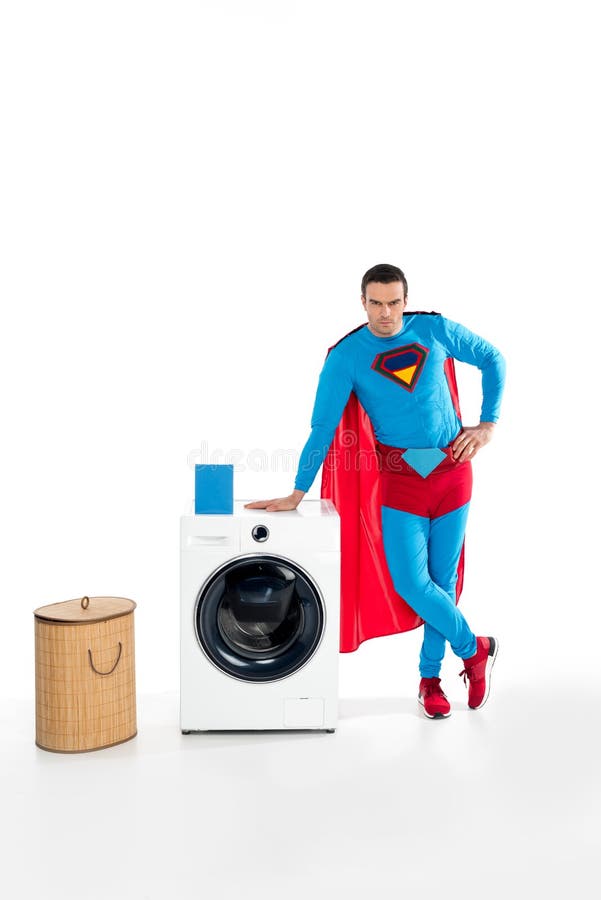 Superman Washing Clothes in Washing Machine and Looking at Camera Stock ...