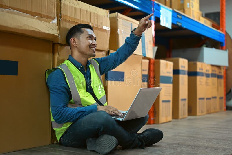 Handsome Male Worker Sitting in Retail Warehouse Full of Cardboard ...