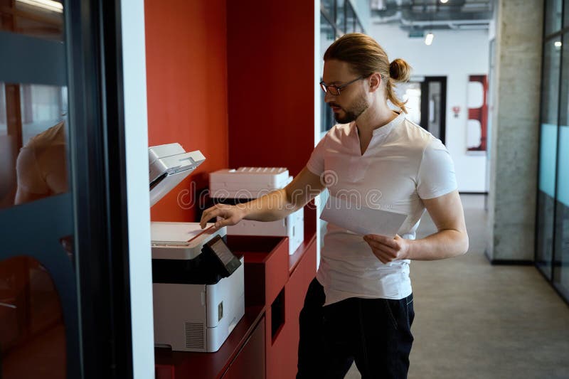 Handsome Male Worker Using Multifunction Printer Indoors Stock Image ...