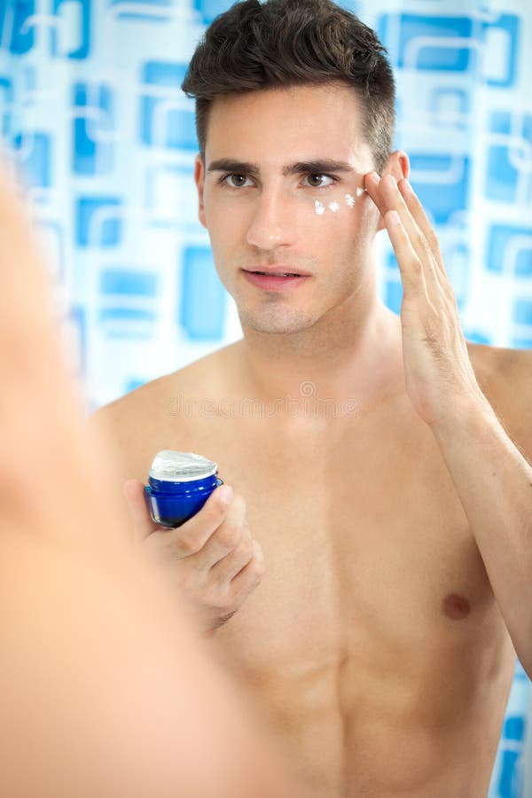 Handsome Man Applying Cream on Face Stock Image - Image of organic ...