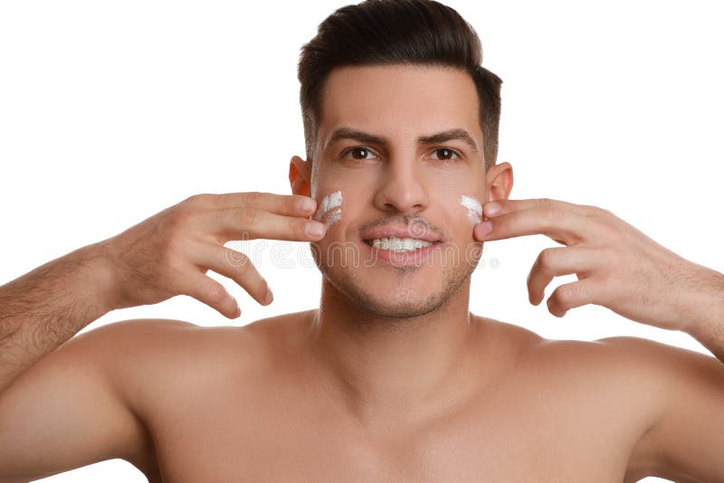 Handsome Man Applying Face Cream on White Background Stock Photo ...