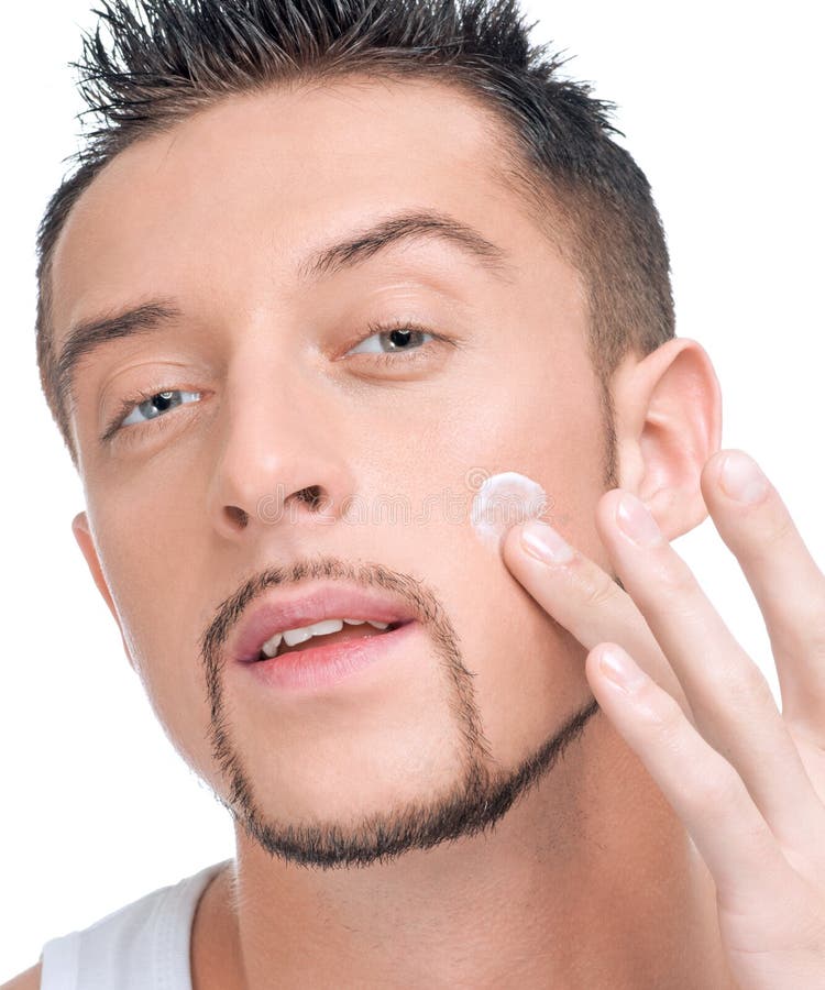 Handsome Man Applying Male Creme on Face Stock Photo - Image of ...