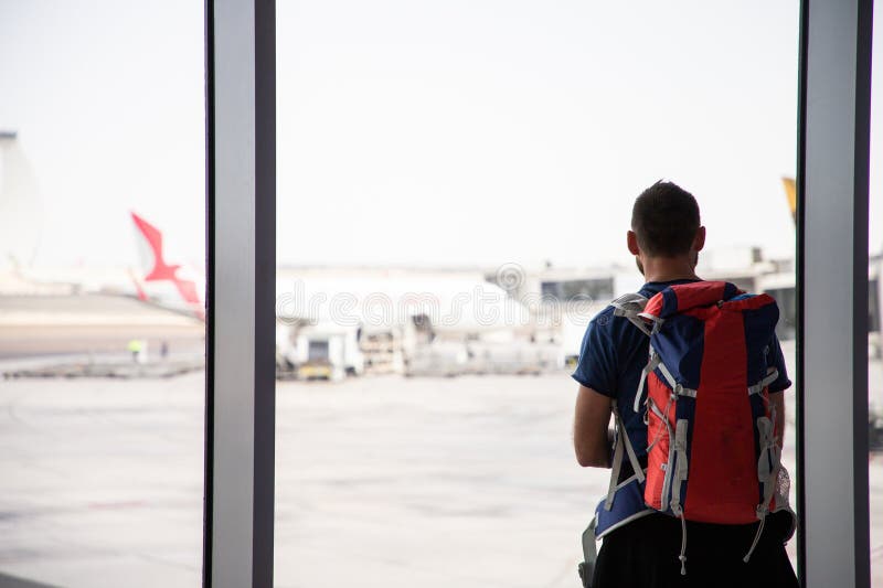 Handsome Man with Backpack Waiting in Airport Stock Photo - Image of ...