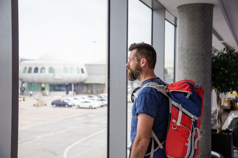 Handsome Man with Backpack Waiting in Airport Stock Photo - Image of ...