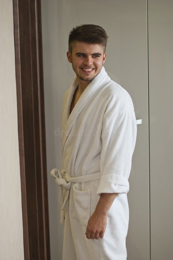 Handsome man in bathrobe stock photo. Image of wellness - 83598054