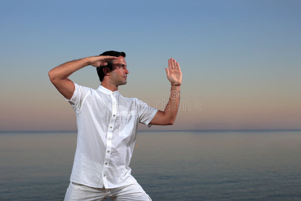 Handsome Man on the Beach Meditating Stock Photo - Image of person ...
