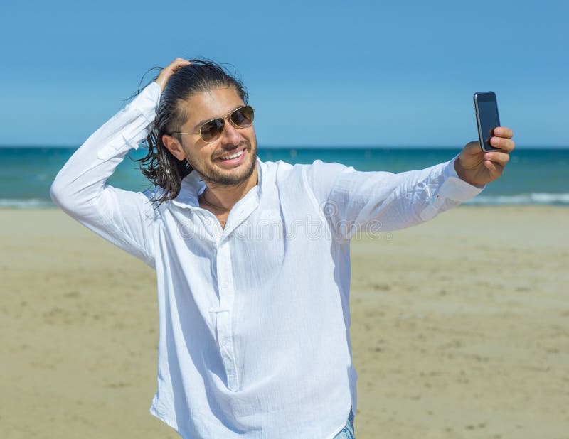 Handsome man on the beach stock image. Image of rimini - 39745027