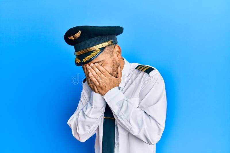 Handsome Man With Beard Wearing Airplane Pilot Uniform With Sad