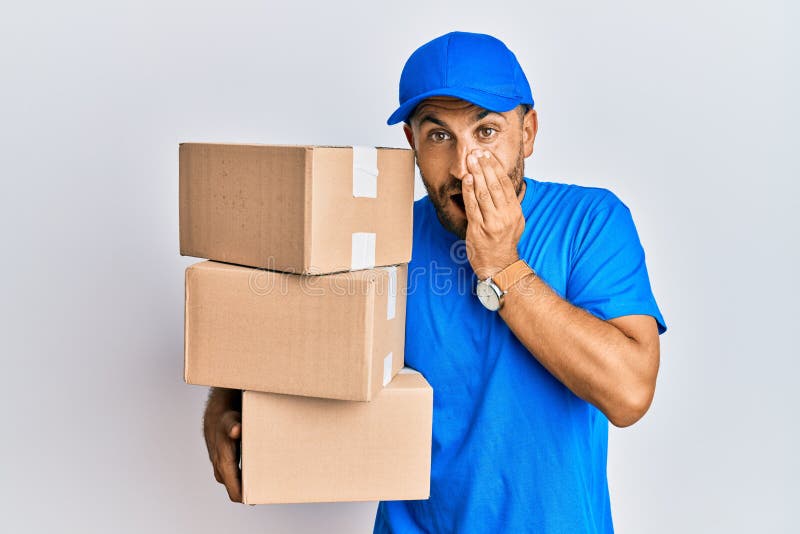 Handsome Man With Beard Wearing Courier Uniform Holding Delivery