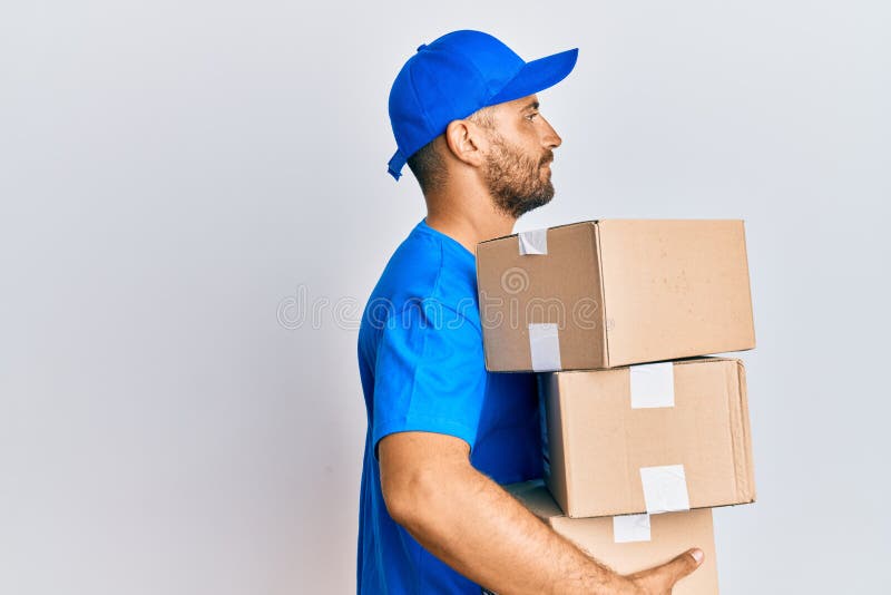 Handsome Man With Beard Wearing Courier Uniform Holding Delivery