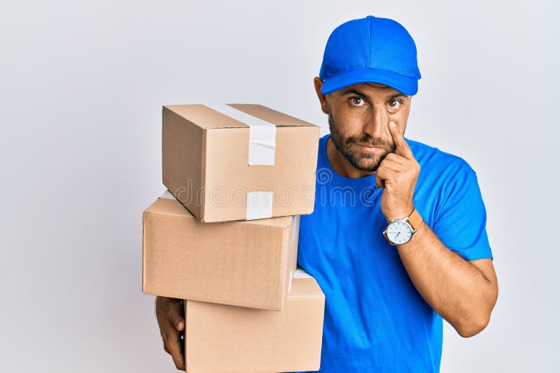 Handsome Man With Beard Wearing Courier Uniform Holding Delivery
