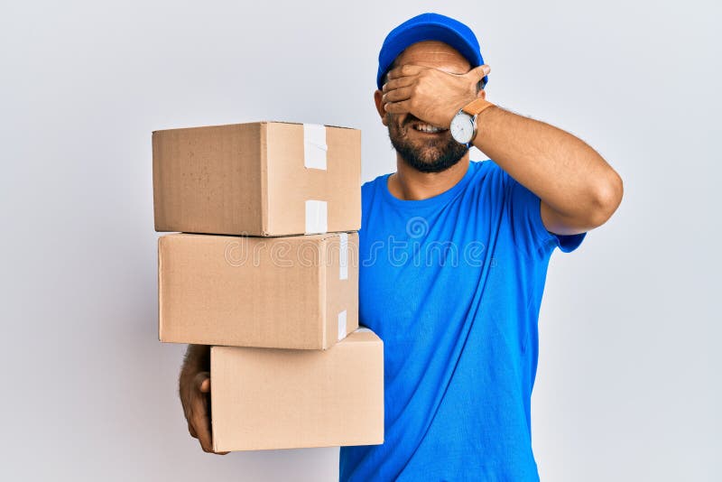 Handsome Man With Beard Wearing Courier Uniform Holding Delivery