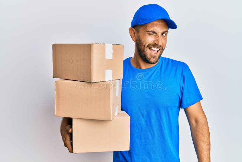 Handsome Man With Beard Wearing Courier Uniform Holding Delivery