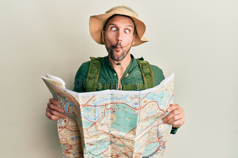 Handsome Man with Beard Wearing Explorer Hat Holding Map Making Fish ...