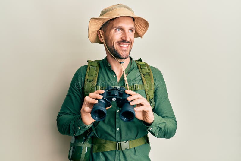Handsome Man with Beard Wearing Explorer Hat Looking through Binoculars ...