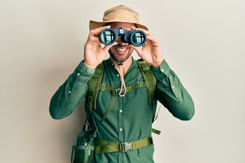 Handsome Man with Beard Wearing Explorer Hat Looking through Binoculars ...