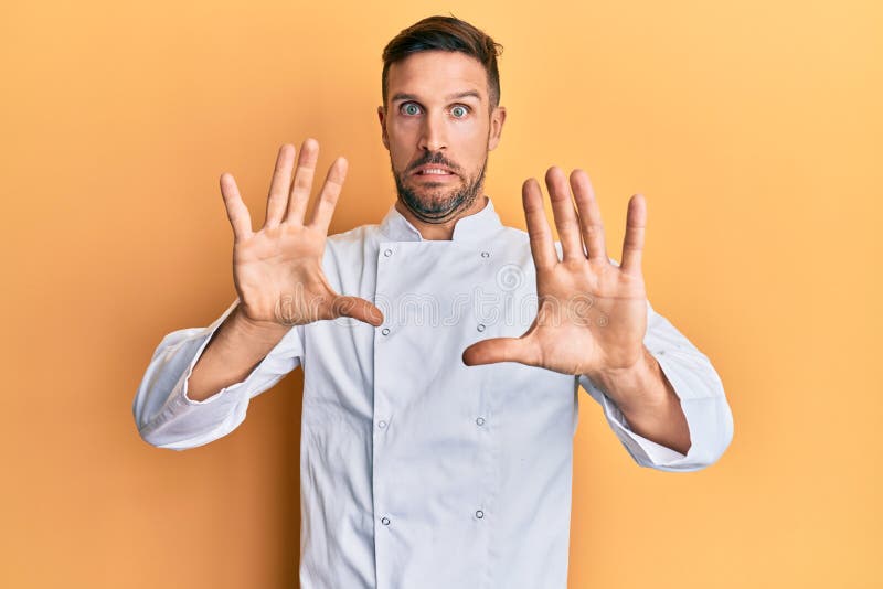 Handsome Man with Beard Wearing Professional Cook Uniform Afraid and ...