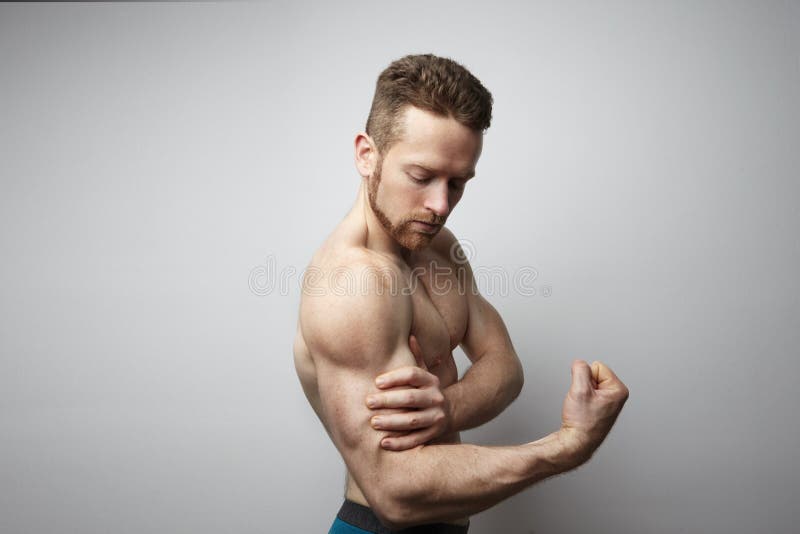Handsome Man with Bicep Ache Stock Image - Image of athletic, painful ...
