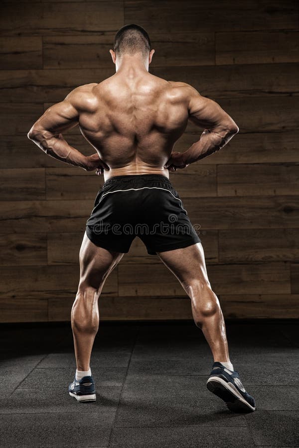Handsome Man with Big Muscles, Posing at the Camera in the Gym Stock ...