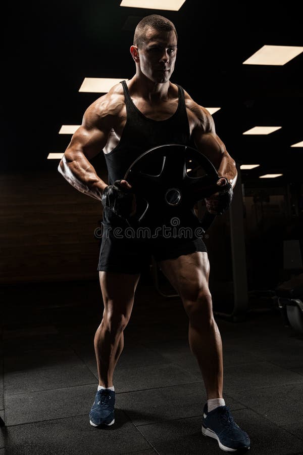 Handsome Man with Big Muscles, Posing at the Camera in the Gym Stock ...