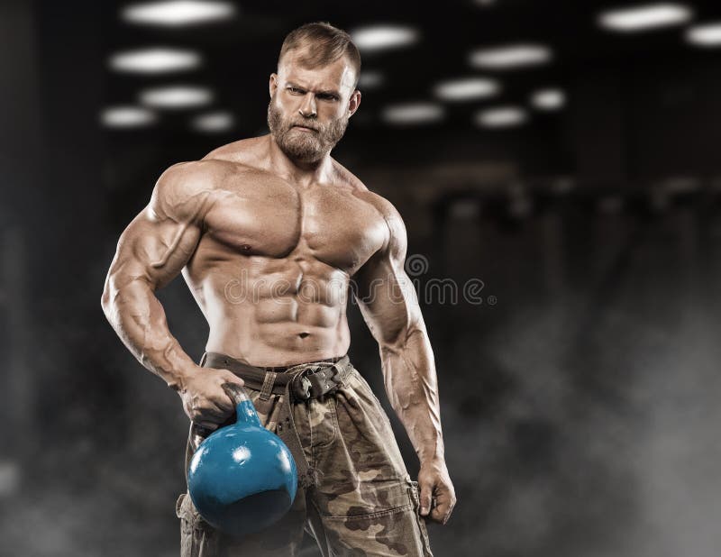 Handsome Man with Big Muscles, Posing at the Camera in the Gym Stock ...