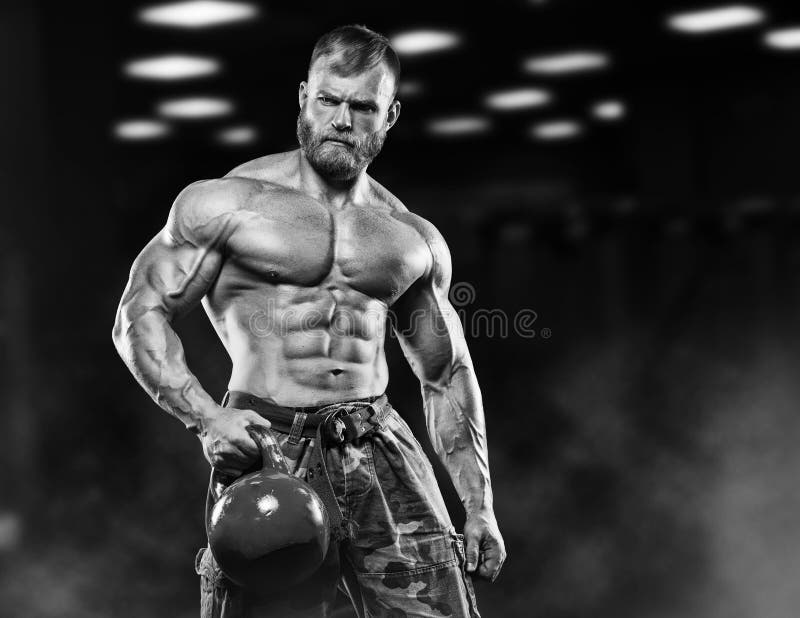 Handsome Man with Big Muscles, Posing at the Camera in the Gym Stock ...