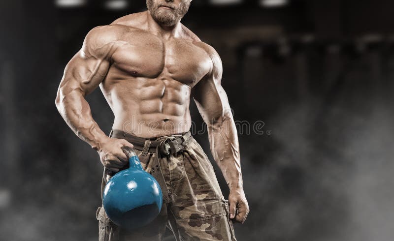 Handsome Man with Big Muscles, Posing at the Camera in the Gym Stock ...