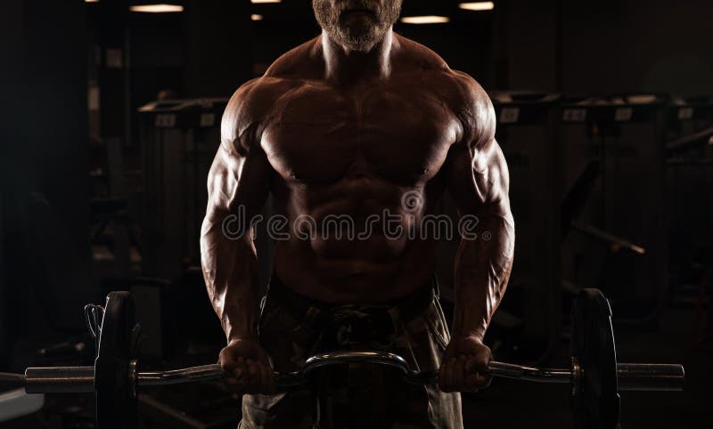 Handsome Man with Big Muscles, Posing at the Camera in the Gym Stock ...