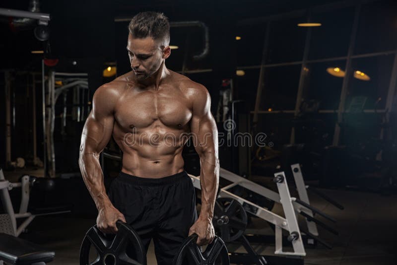 Handsome Man with Big Muscles, Posing at the Camera in the Gym Stock ...