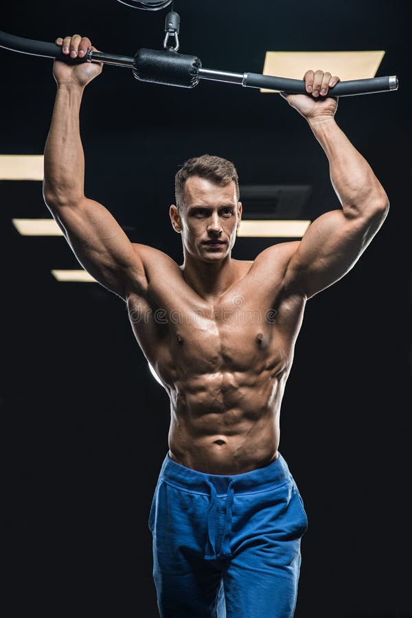 Handsome Man with Big Muscles, Posing at the Camera in the Gym Stock ...