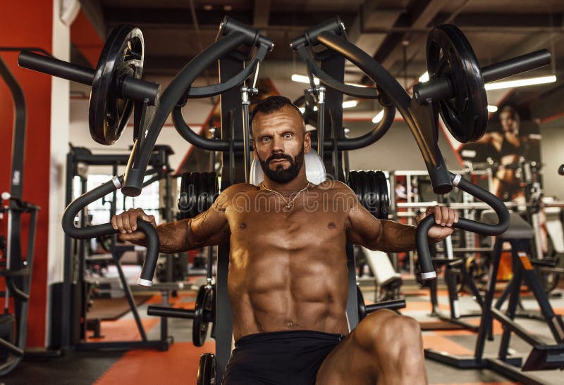 Handsome Man with Big Muscles Working Out in Gym. Muscular Bodybuilder ...