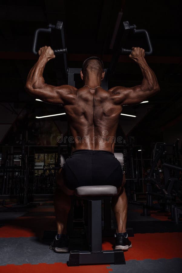 Handsome Man with Big Muscles Working Out in Gym. Muscular Bodybuilder ...