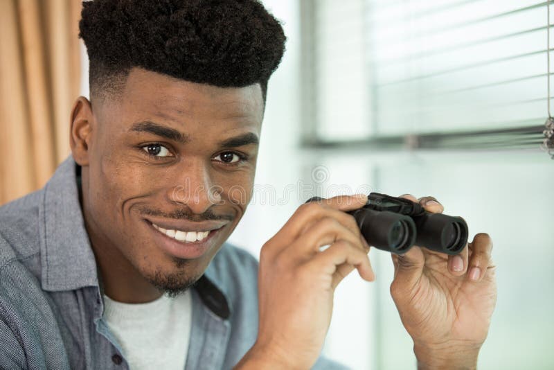 Handsome Man with Binoculars Inside House Stock Image - Image of ...