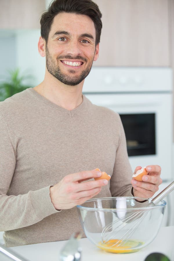 Handsome Man Breaks Eggs into Transparent Bowl Stock Photo - Image of ...