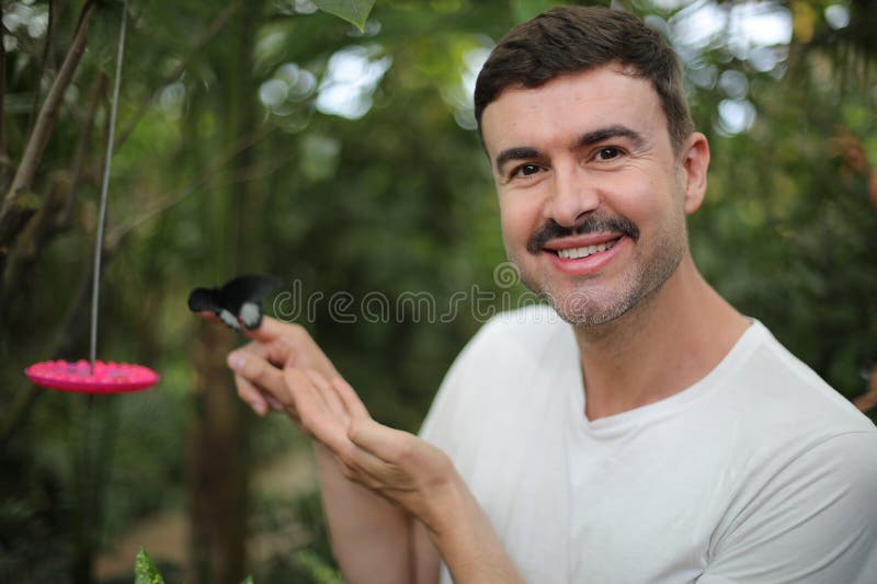 A Handsome Man Breeding Butterflies Stock Photo - Image of hand ...
