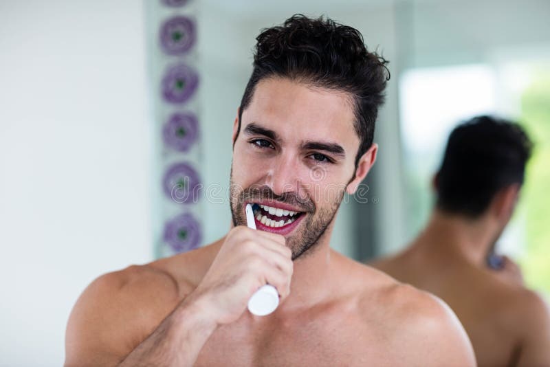Handsome Man Brushing His Teeth Stock Photo - Image of holding ...