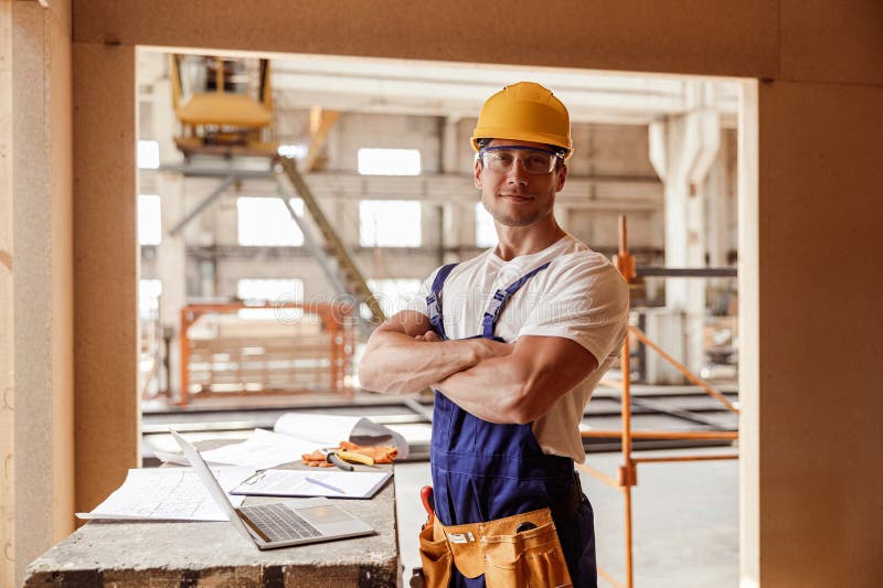 Handsome Man Builder Standing by the Table with Laptop Stock Image ...