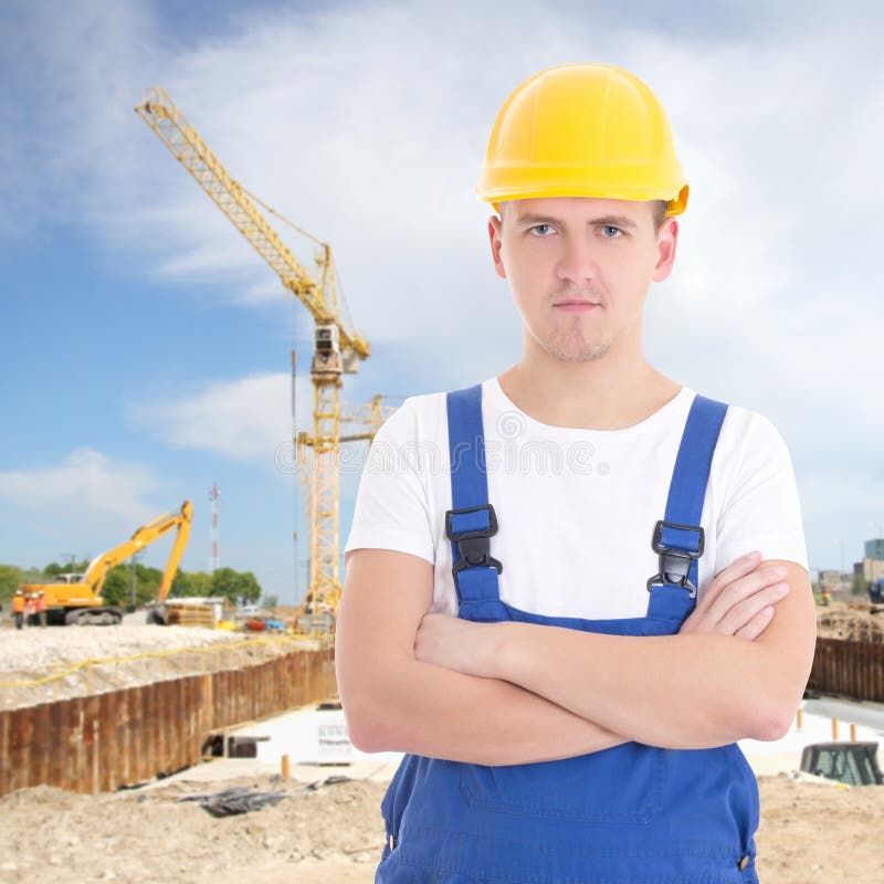 Handsome Man in Builder Uniform at Construction Site Stock Photo ...