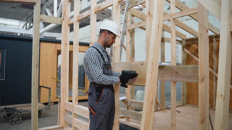 Handsome Man Builder Working at Prefabricated House Building ...