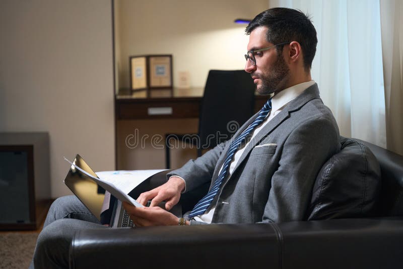 Handsome Man in a Business Suit is Studying Working Documents Stock ...